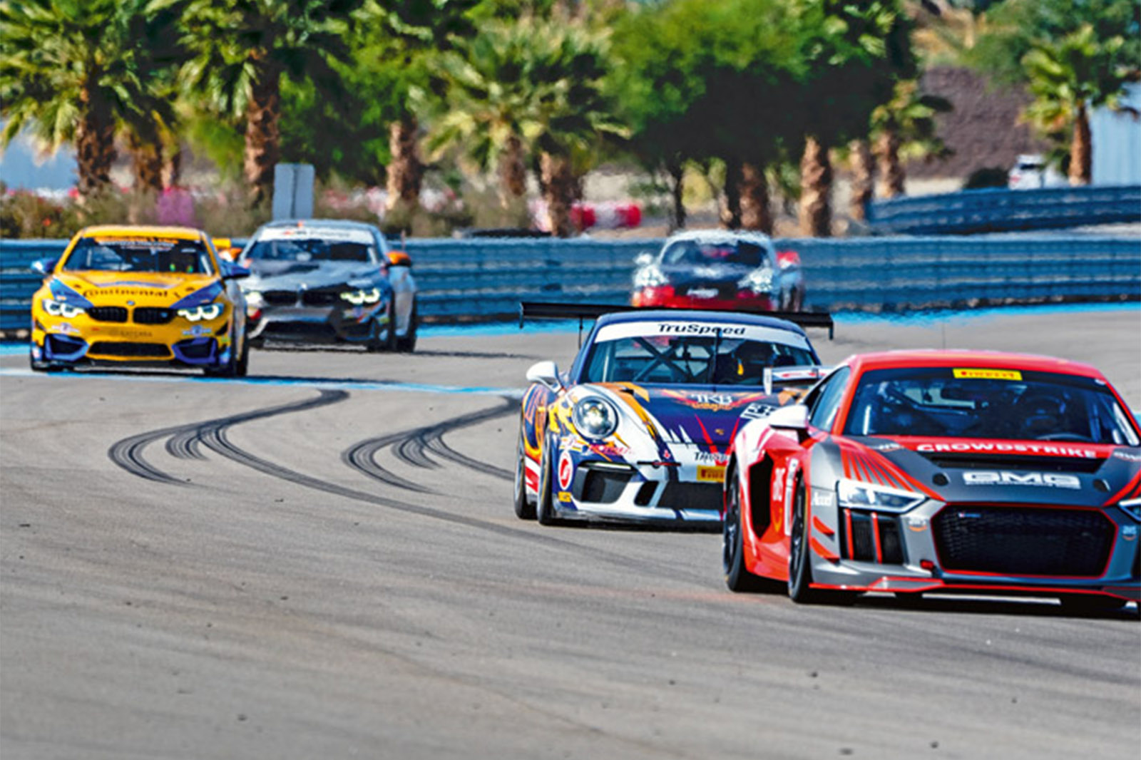 Race Cars Racing On A Track