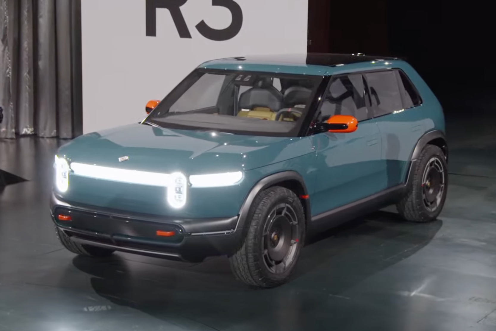 Rivian shocks with hot electric crossover at R2 unveiling | Autocar